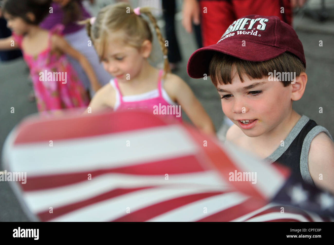 Waving American Flag, young boy and girls watching Merrick Memorial Day ...