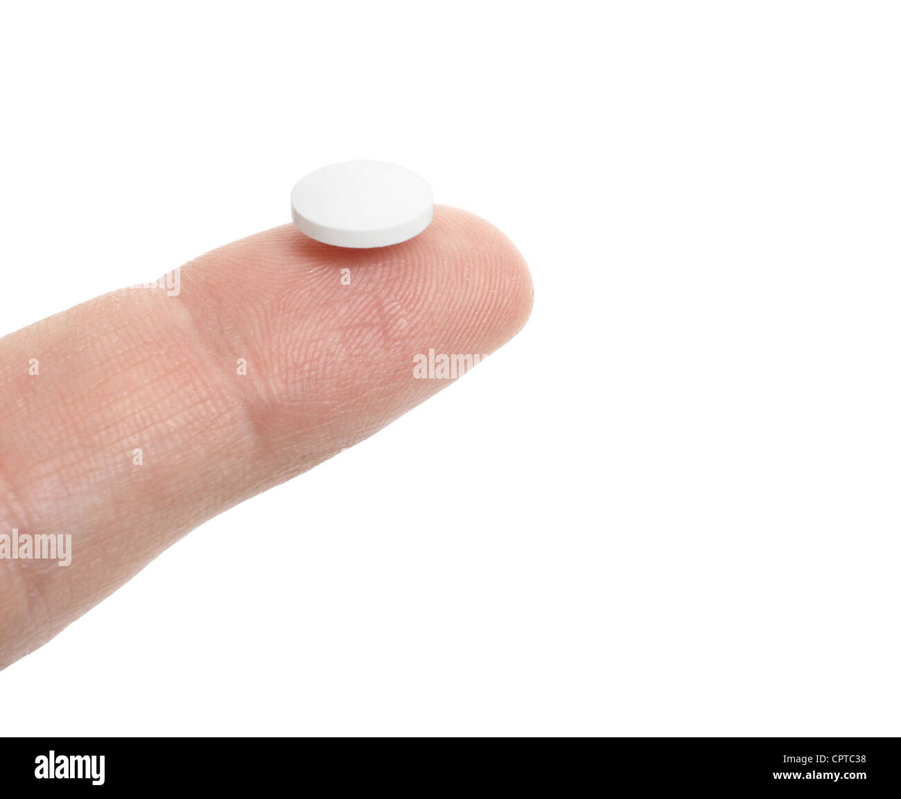 A white pill in the hand Stock Photo - Alamy