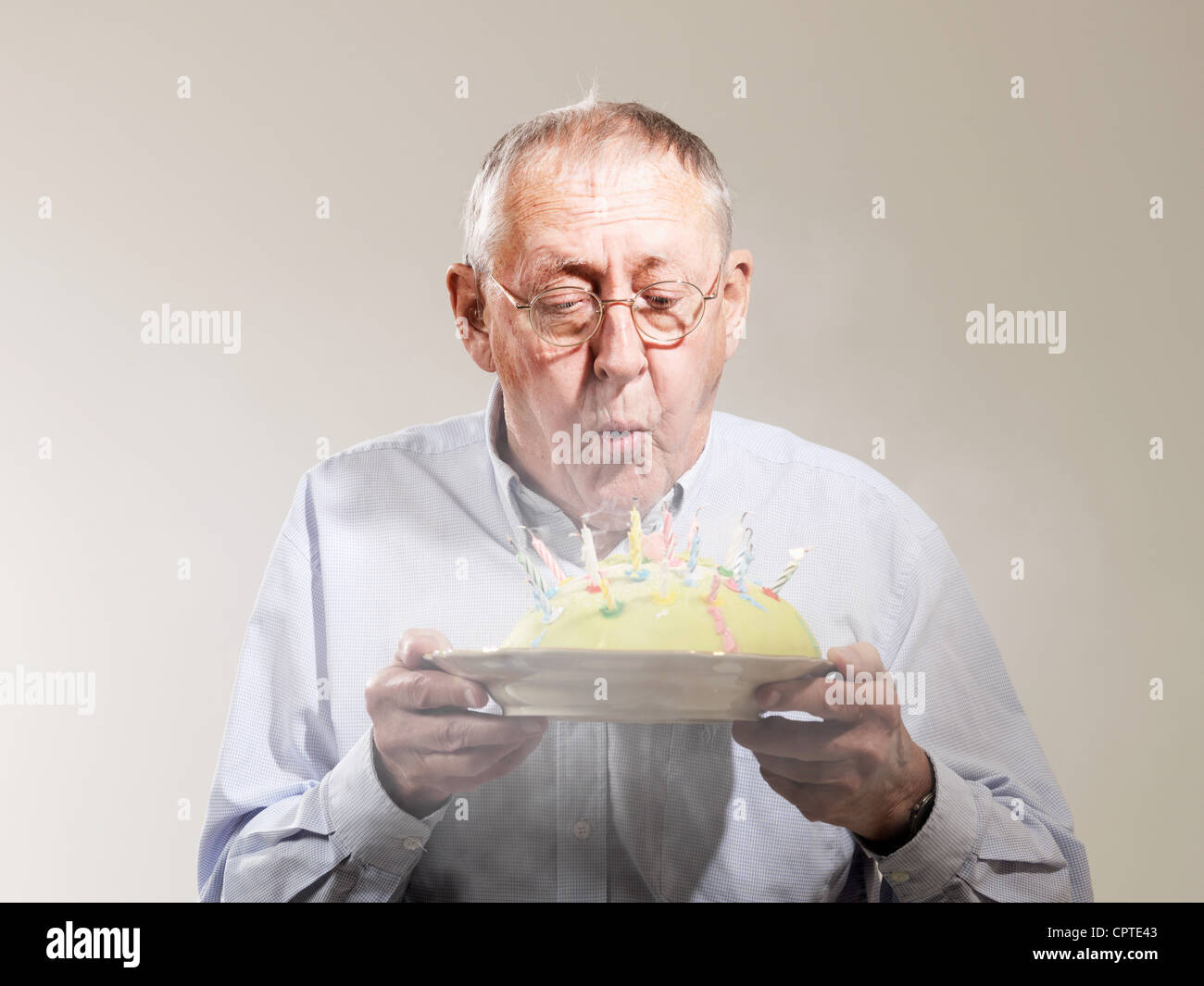 Brithday cake blowing hi-res stock photography and images - Alamy