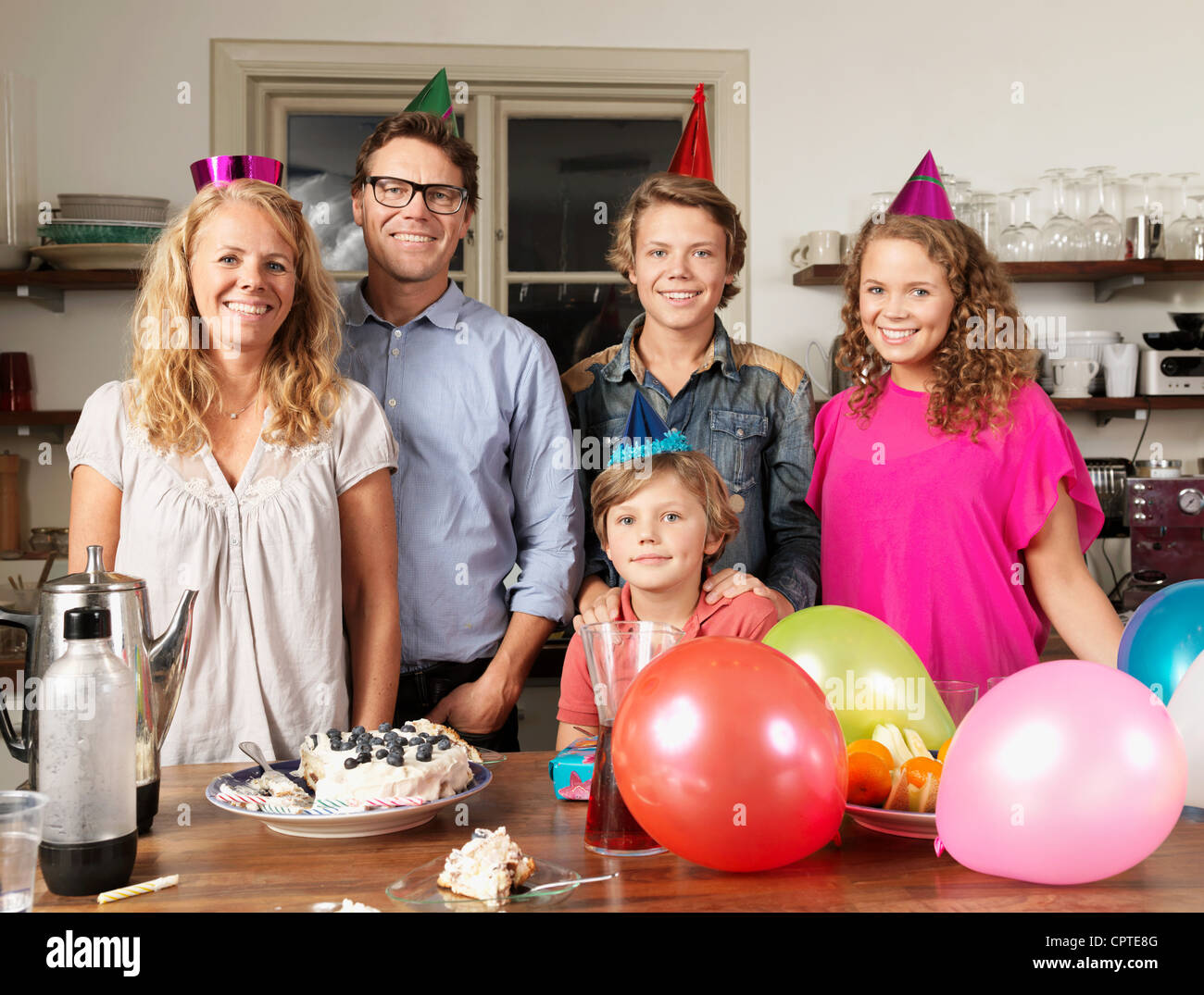 Portrait of family at birthday party Stock Photo - Alamy