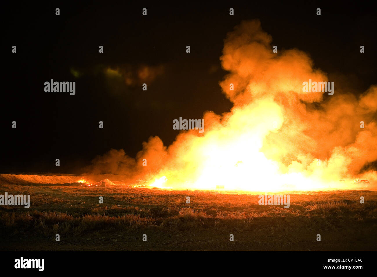 Fire at night in field Stock Photo - Alamy
