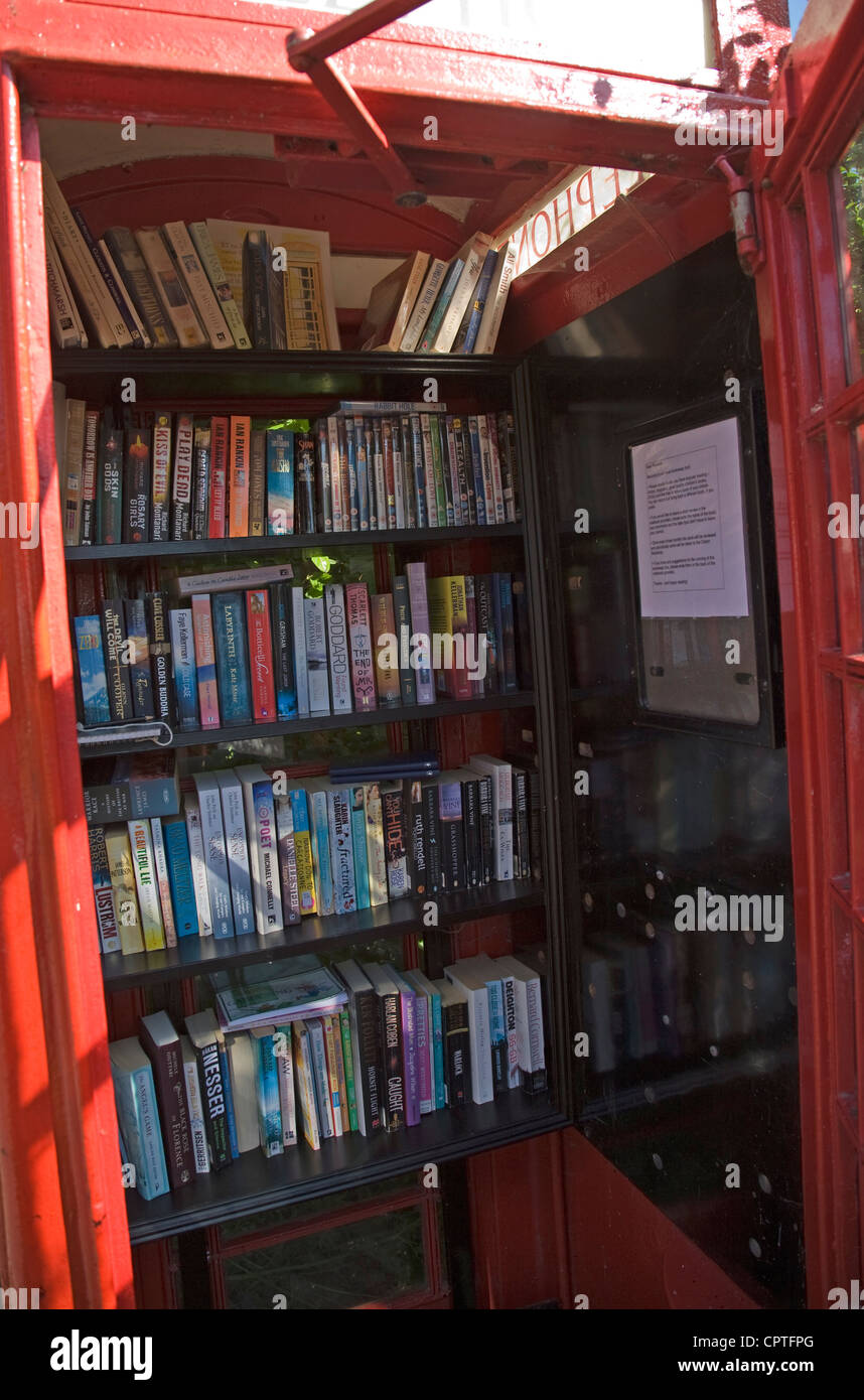 Old red telephone box used as village book exchange Stock Photo - Alamy