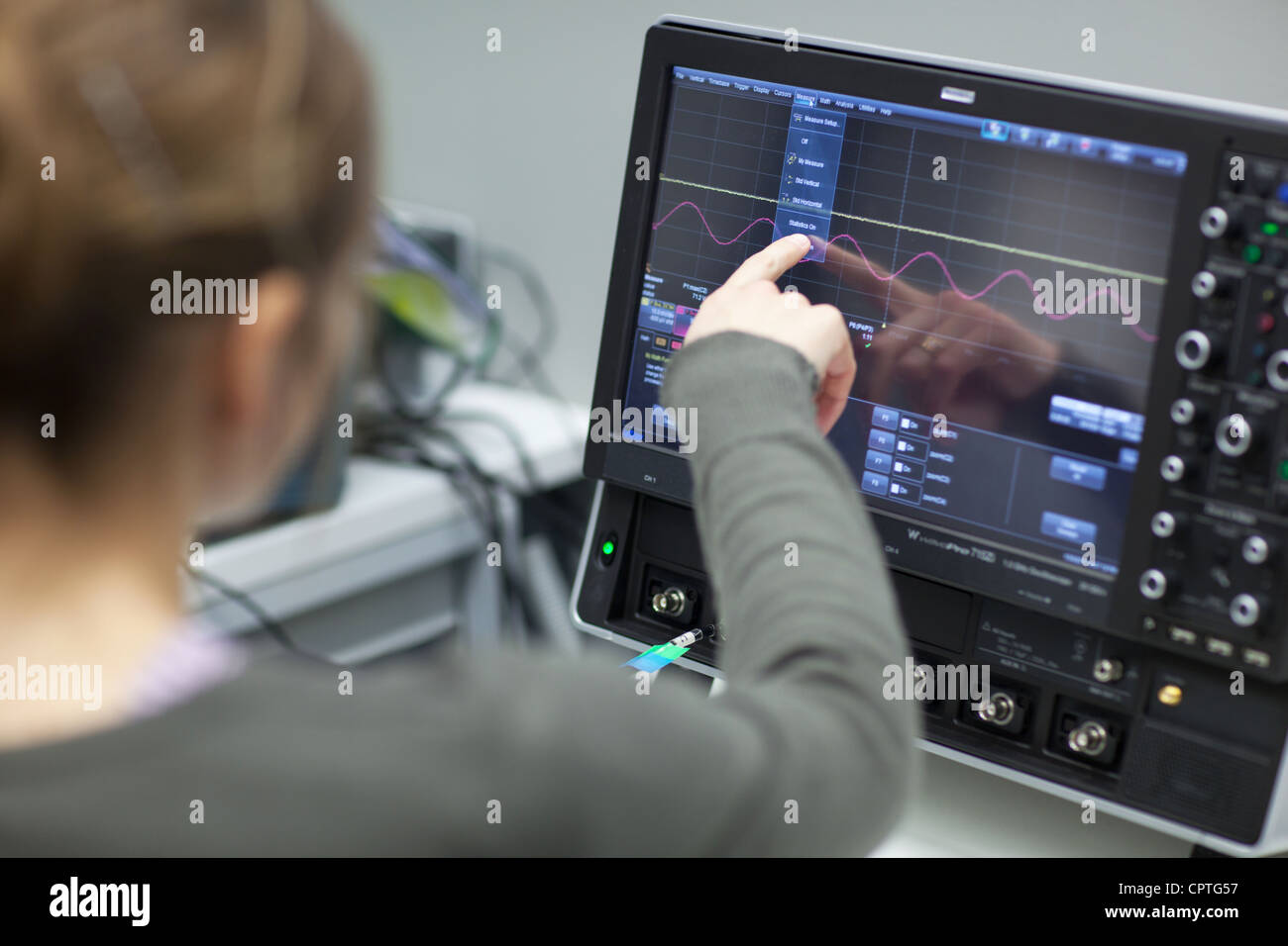 female scientist doing research in a quantum optics lab (color toned ...