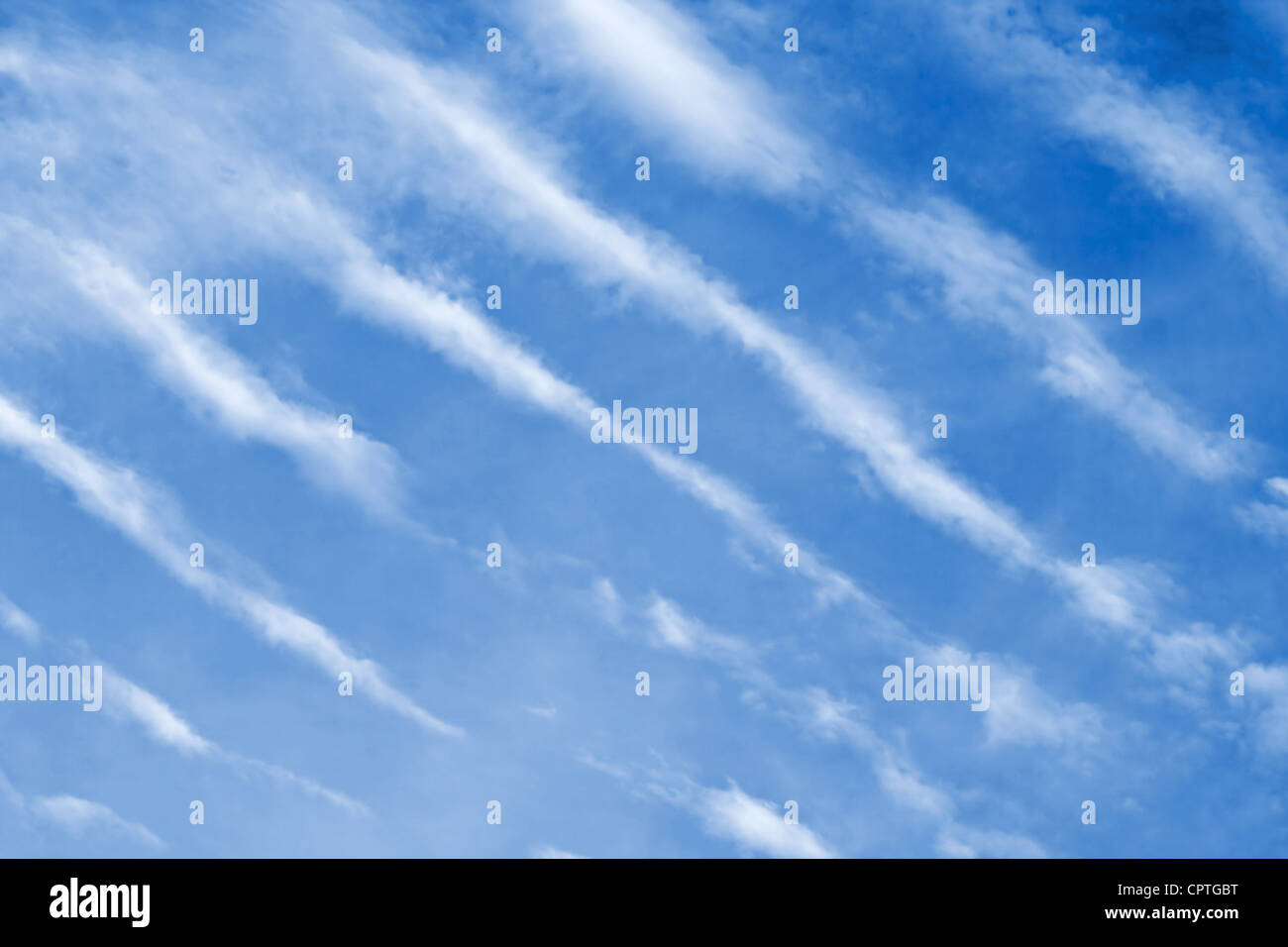 Stripes of windy clouds on the blue sky Stock Photo - Alamy