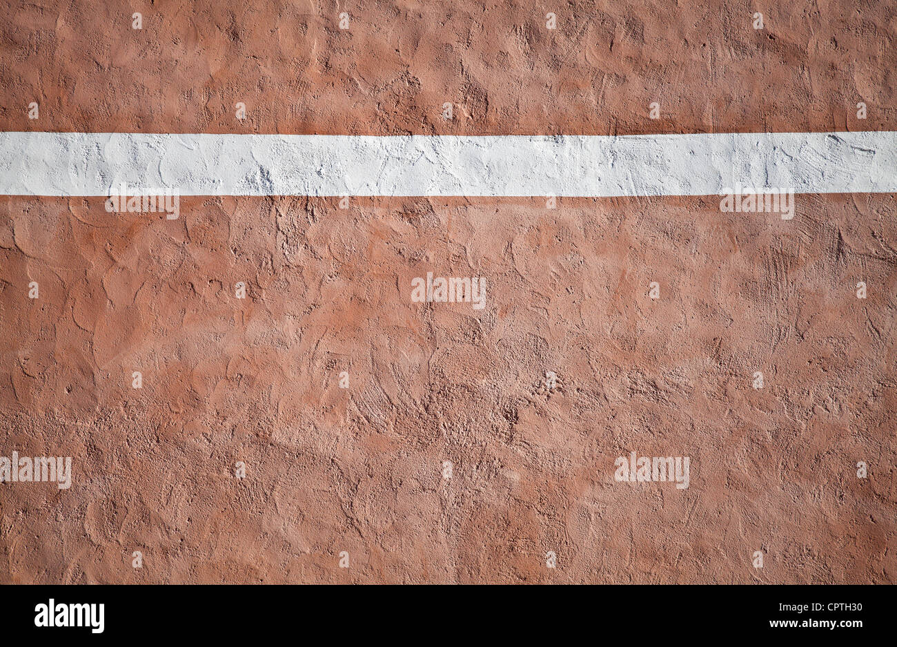 Closeup red painted stone wall texture with red plaster and white ...