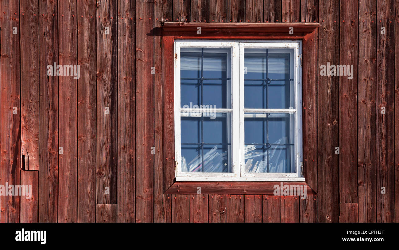 Texture of a window on the old red wooden wall. Traditional ...