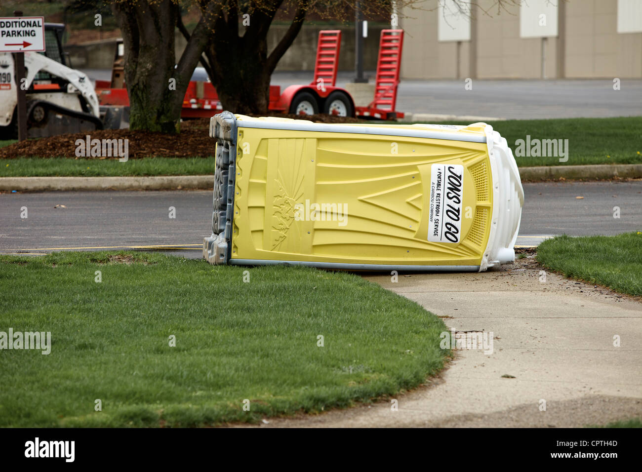 Portable toilet pushed over on its side Stock Photo - Alamy