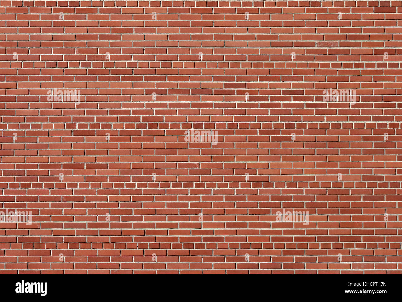 Small-scale red brick wall Stock Photo - Alamy
