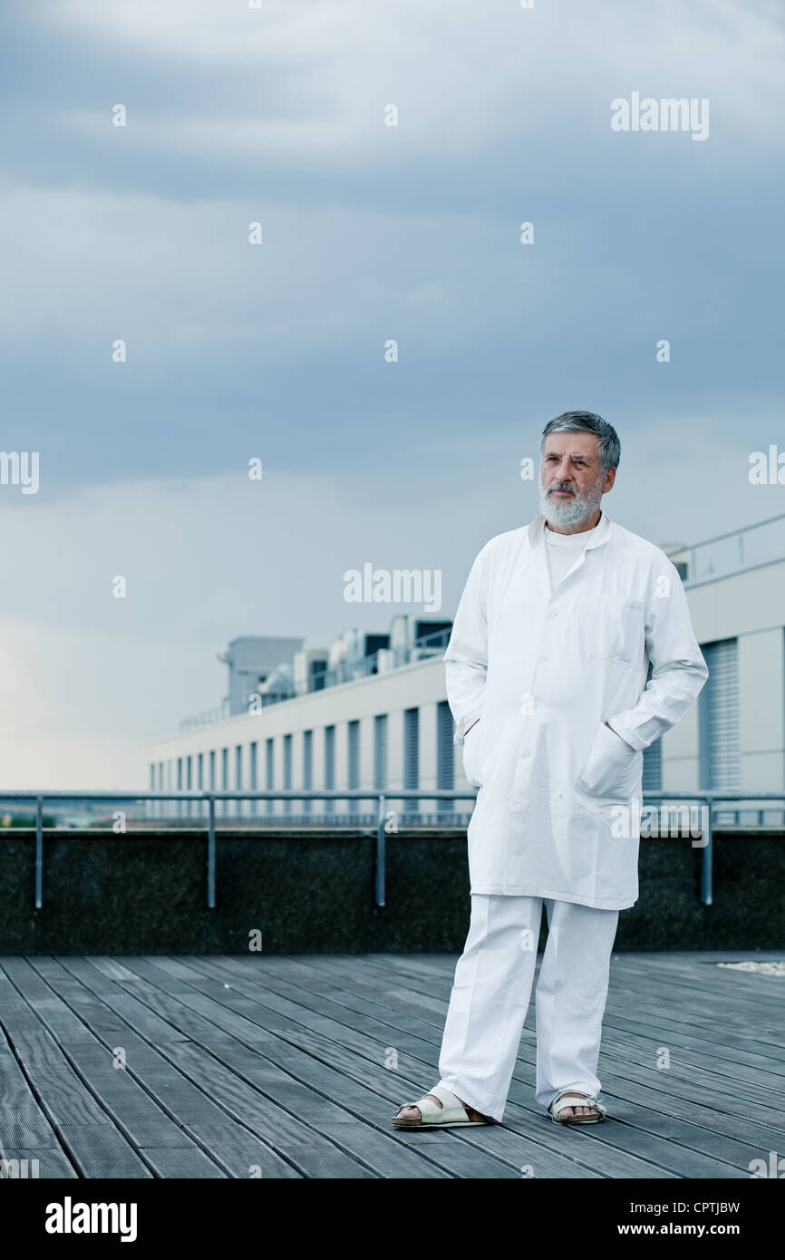 renowned scientist/doctor standing on the roof of the research center ...