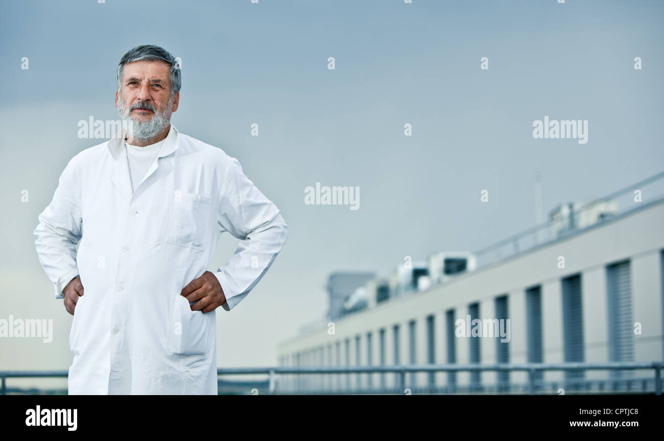 renowned scientist/doctor standing on the roof of the research center ...