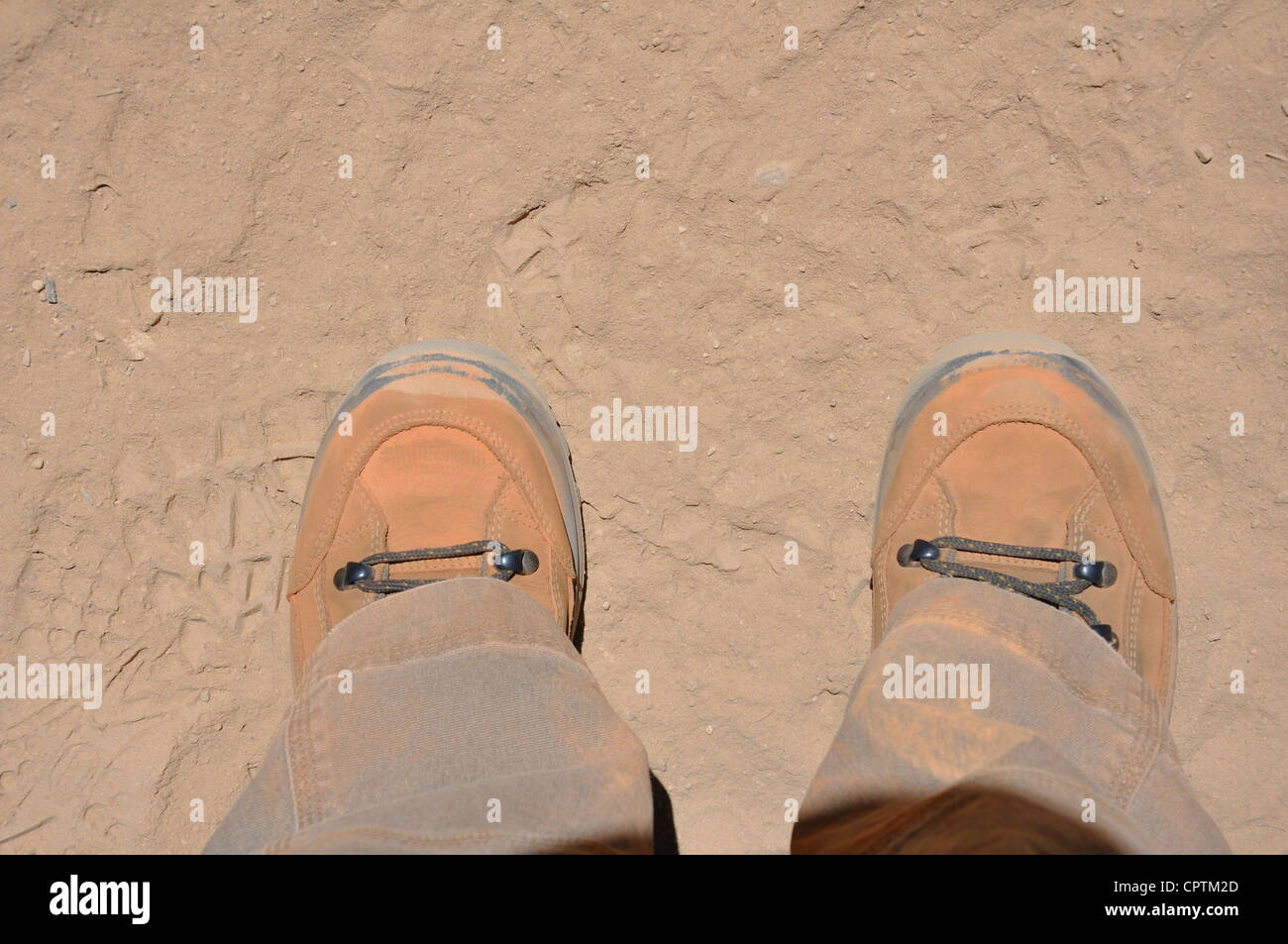 Hiking boots in dust Stock Photo - Alamy