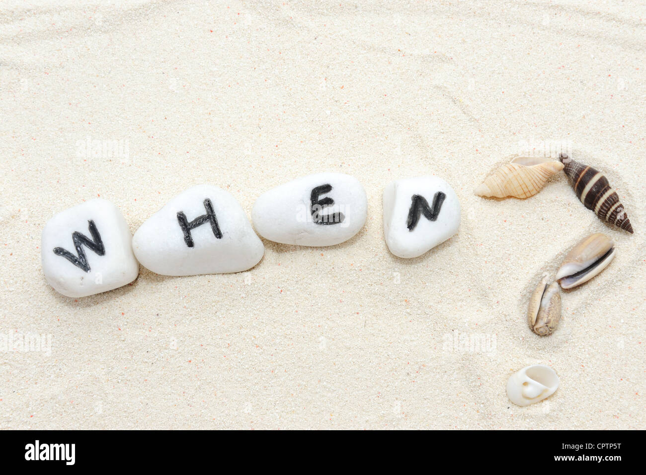 When word on group of stones with sand background Stock Photo - Alamy