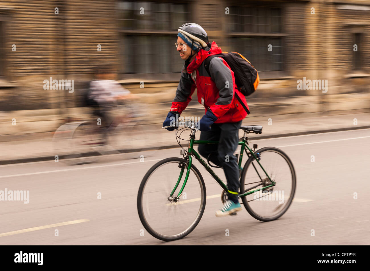 A man cycling on a bike showing movement in Cambridge , England ...