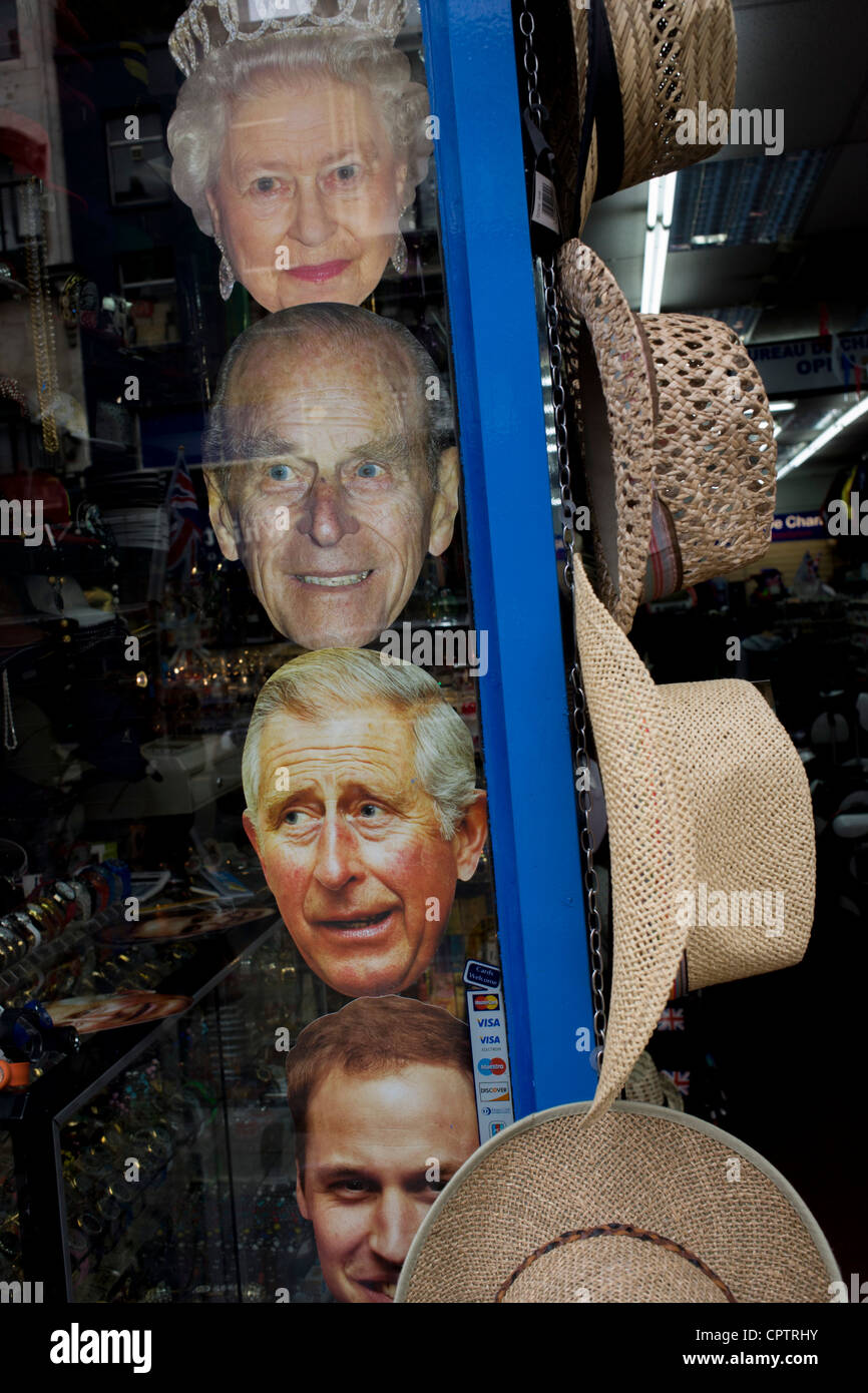 Masks of members of the Uk royal family including the Queen at the top ...