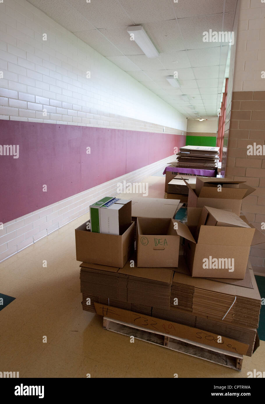 Boxes fill up empty hallway of elementary school building which will be ...