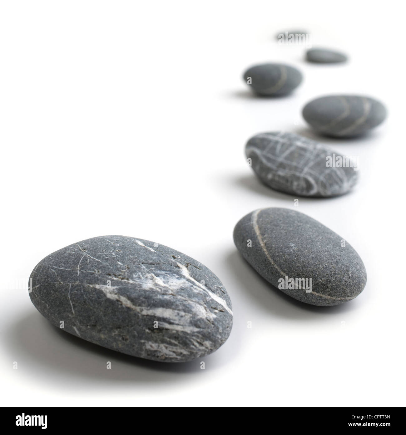Snaking line of black and grey pebbles Stock Photo - Alamy