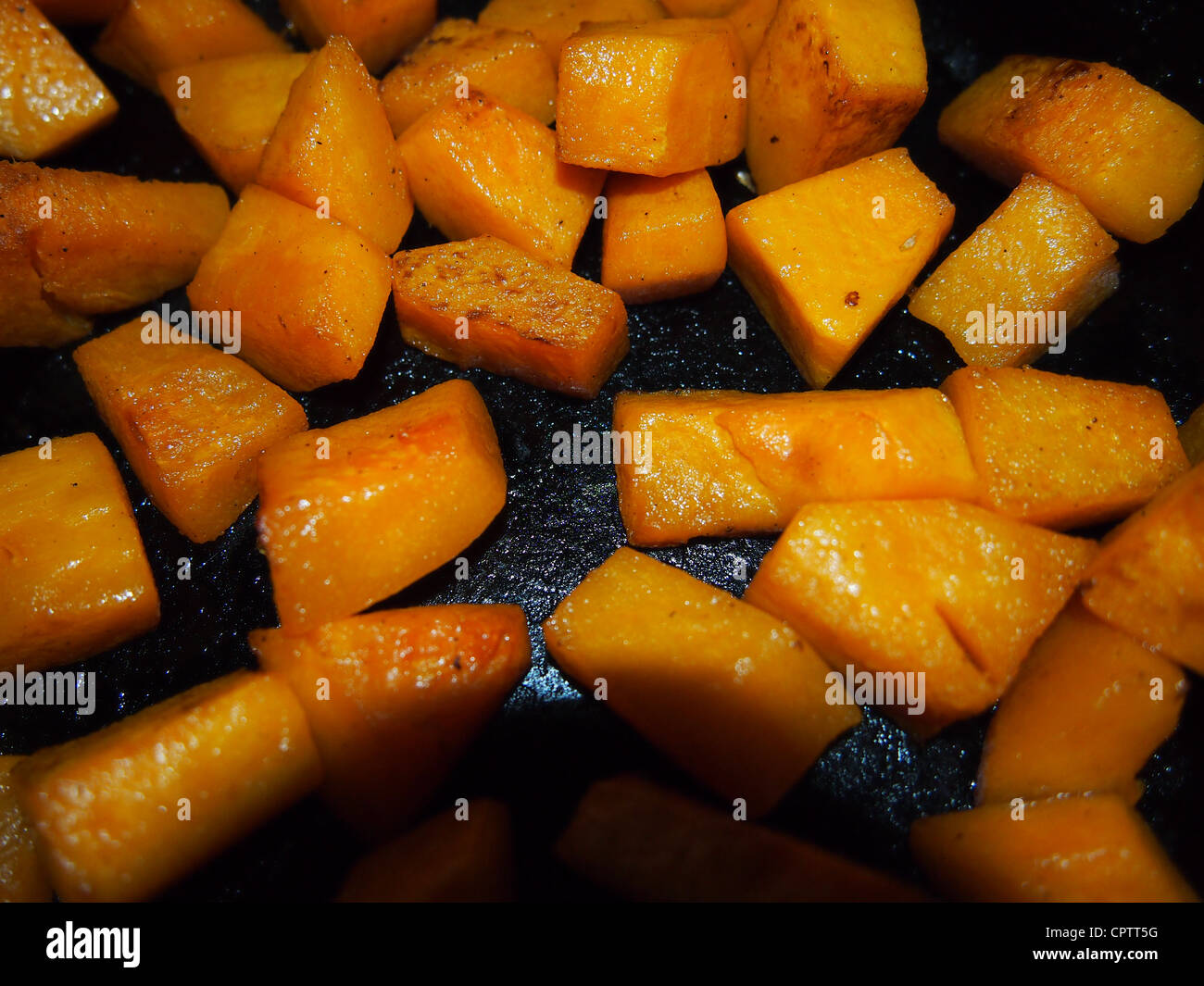Fried butternut squash chunks Stock Photo - Alamy