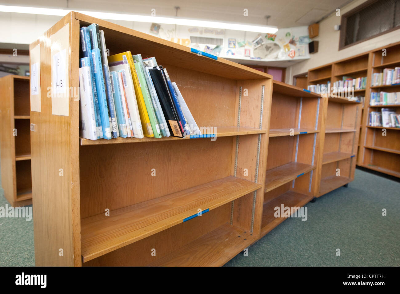 Teachers, students and librarians help pack up materials. The ...