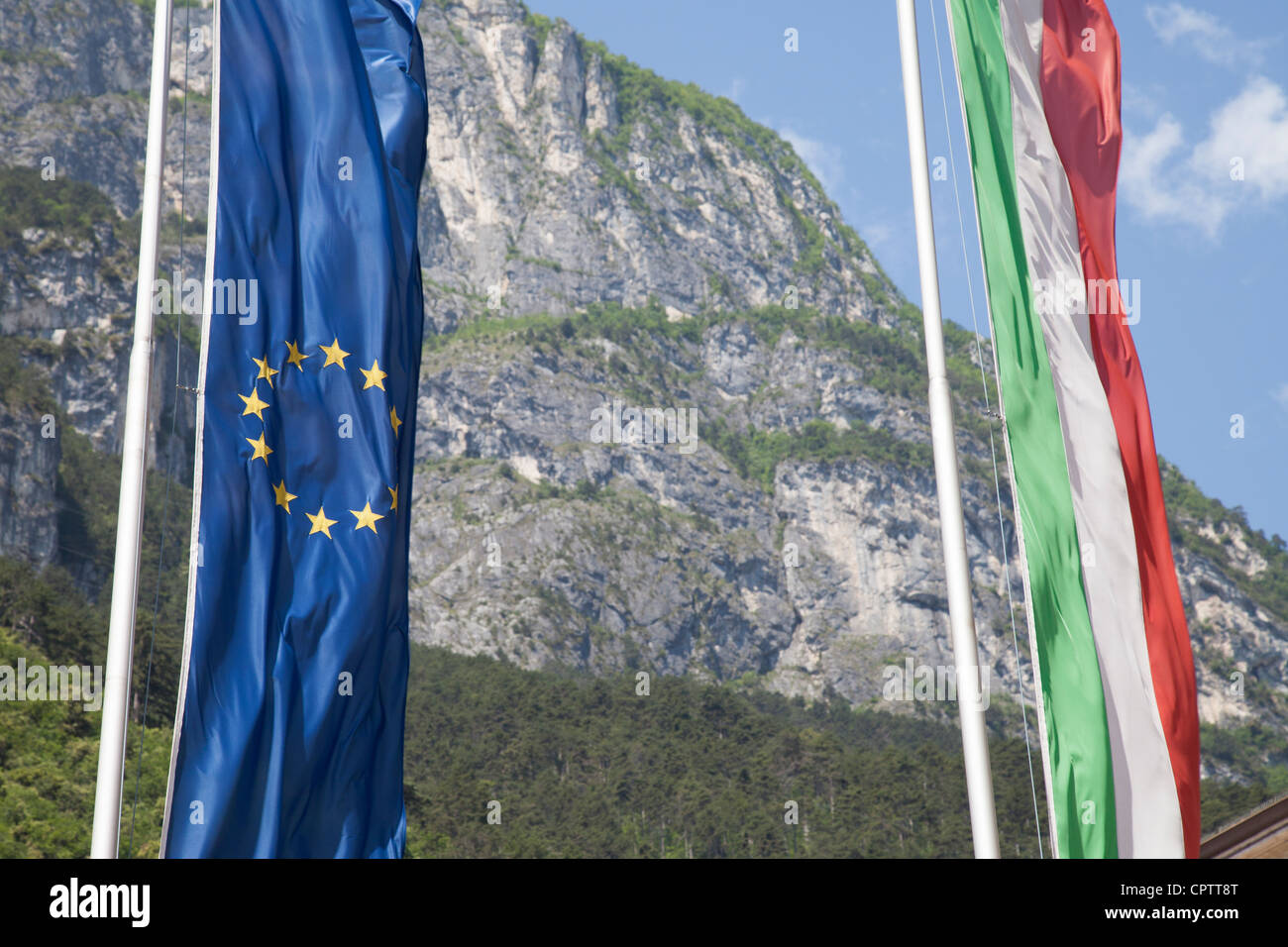 EU European and italy italian italia flag with mountainous background ...
