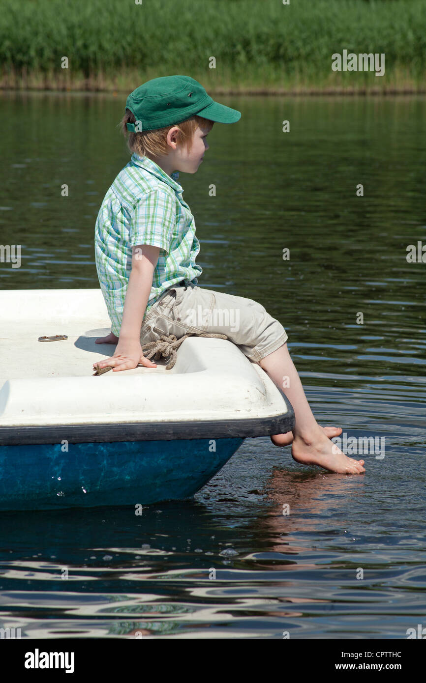 portrait of a young boy on a boat Stock Photo - Alamy