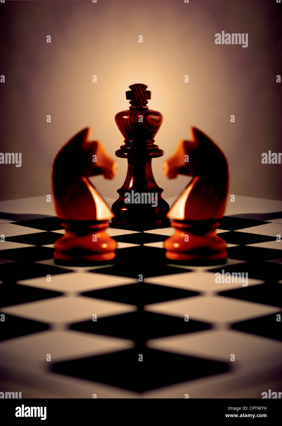 Black king with light behind, two white knights mirrored for symmetry ...