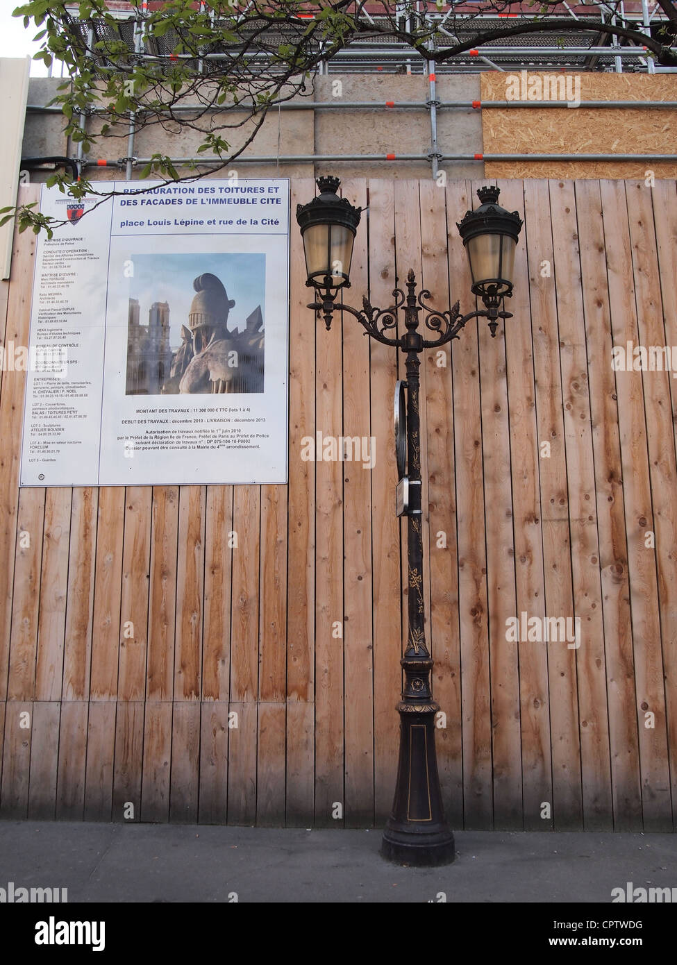 Street lamp and construction fence at a restoration project in Paris ...