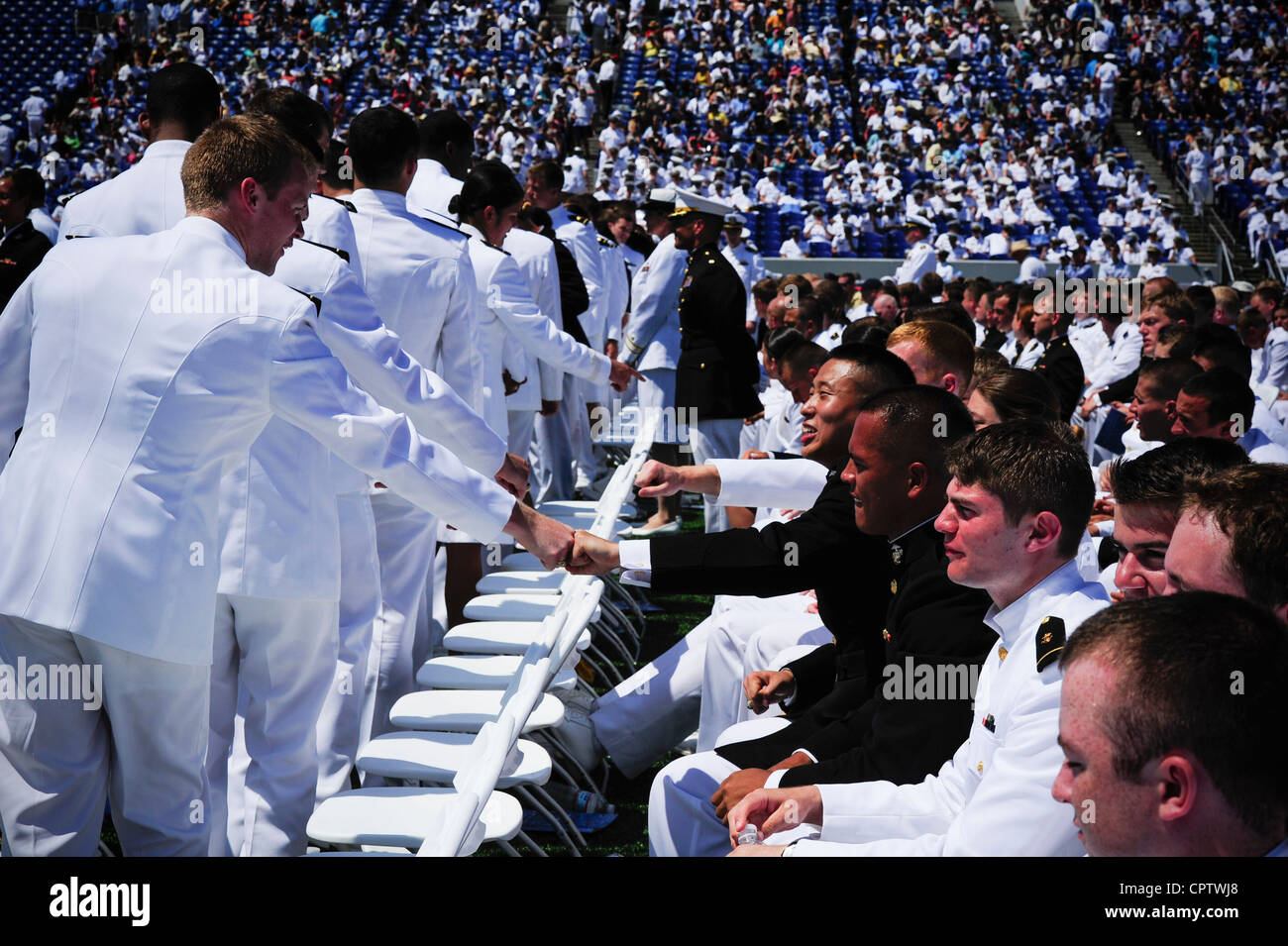 Newly commissioned ensigns and second lieutenants congratulate each ...