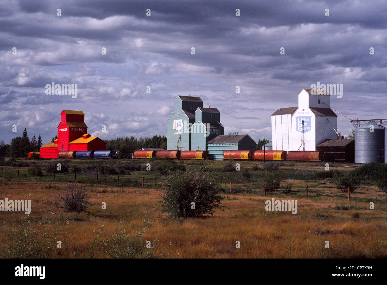 Grain rail cars await loading at the grain elevators in Gleichen ...