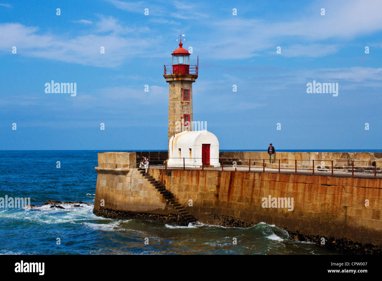lighthouse on a pier on the Atlantic ocean coast in Porto, Portugal ...