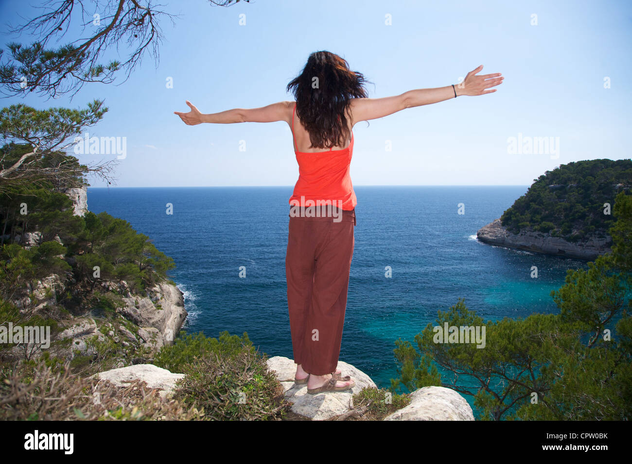 Woman on top at Menorca island in Spain Stock Photo - Alamy