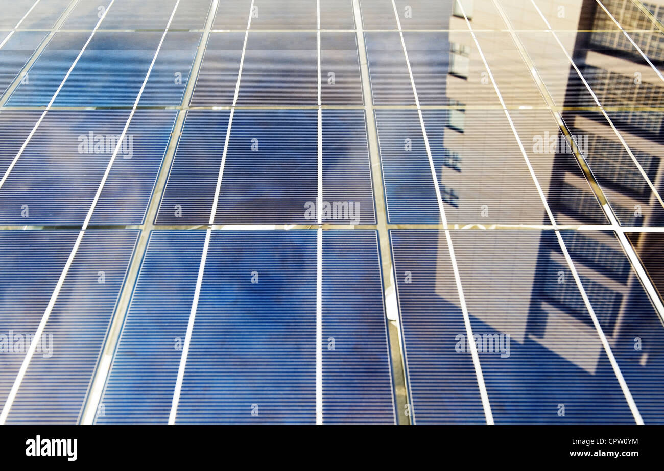 Building and sky reflected in modern high efficiency photovoltaic ...