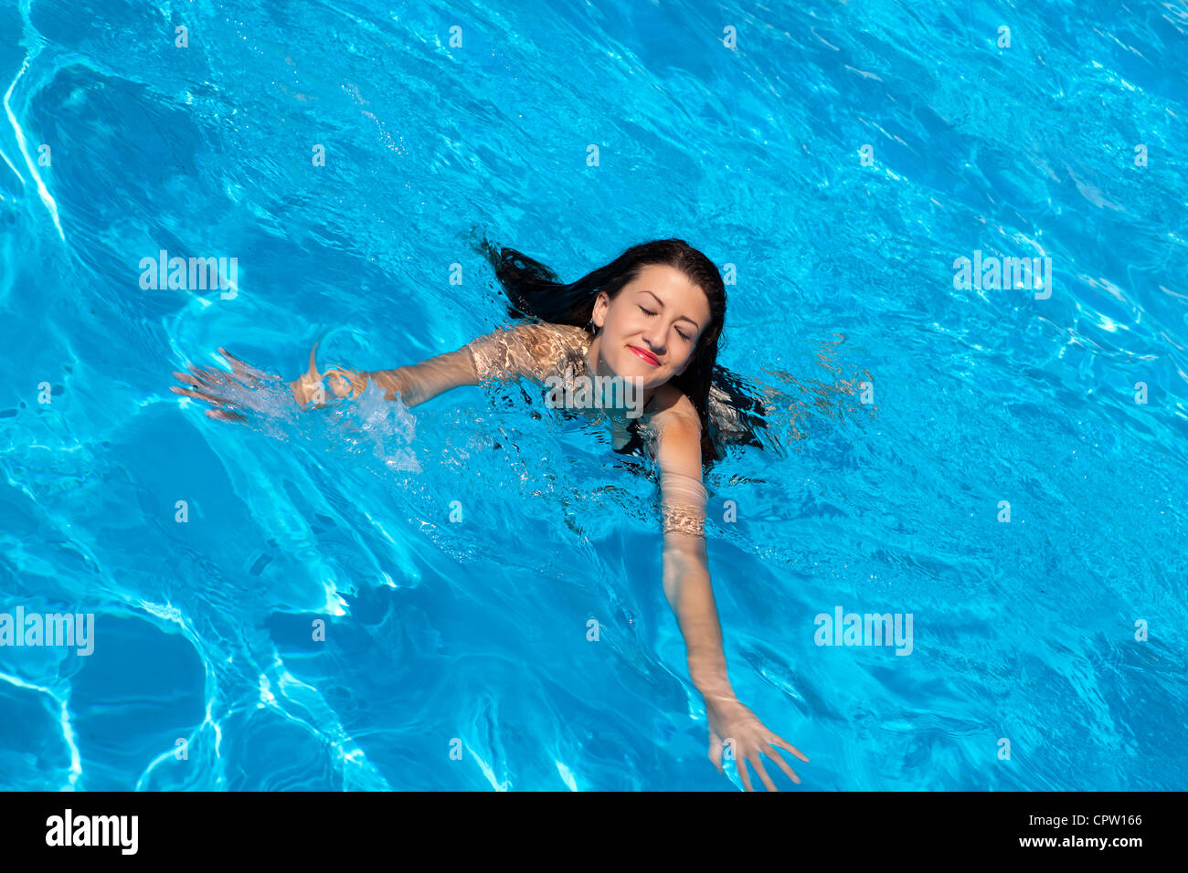Woman swimming in pool water hi-res stock photography and images - Alamy
