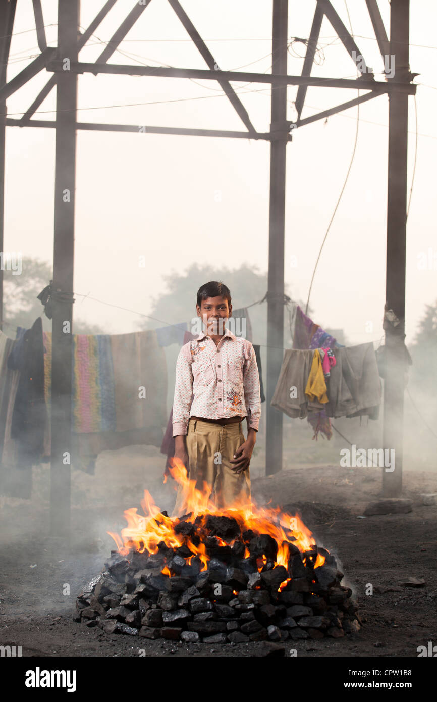 Young boy with burning coal , Jharia, Dhanbad, Jharkhand, India Stock ...