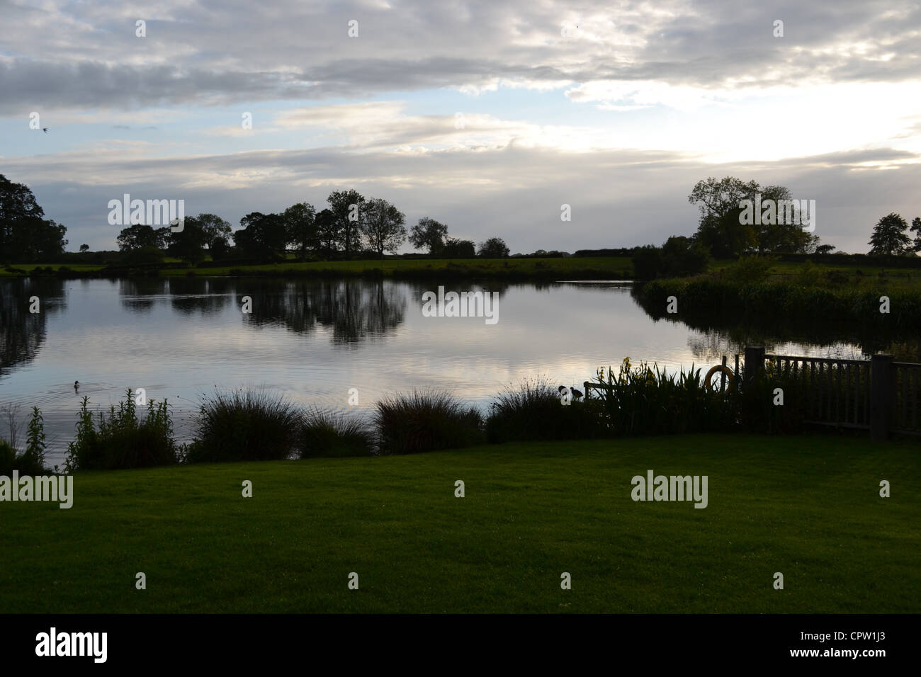 View of lake showing the reflection of the sky Stock Photo - Alamy