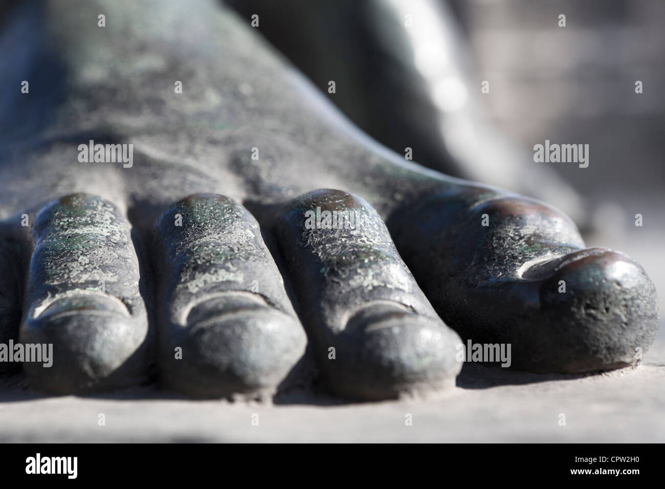 Detail of the toes of a large bronze statue Stock Photo - Alamy