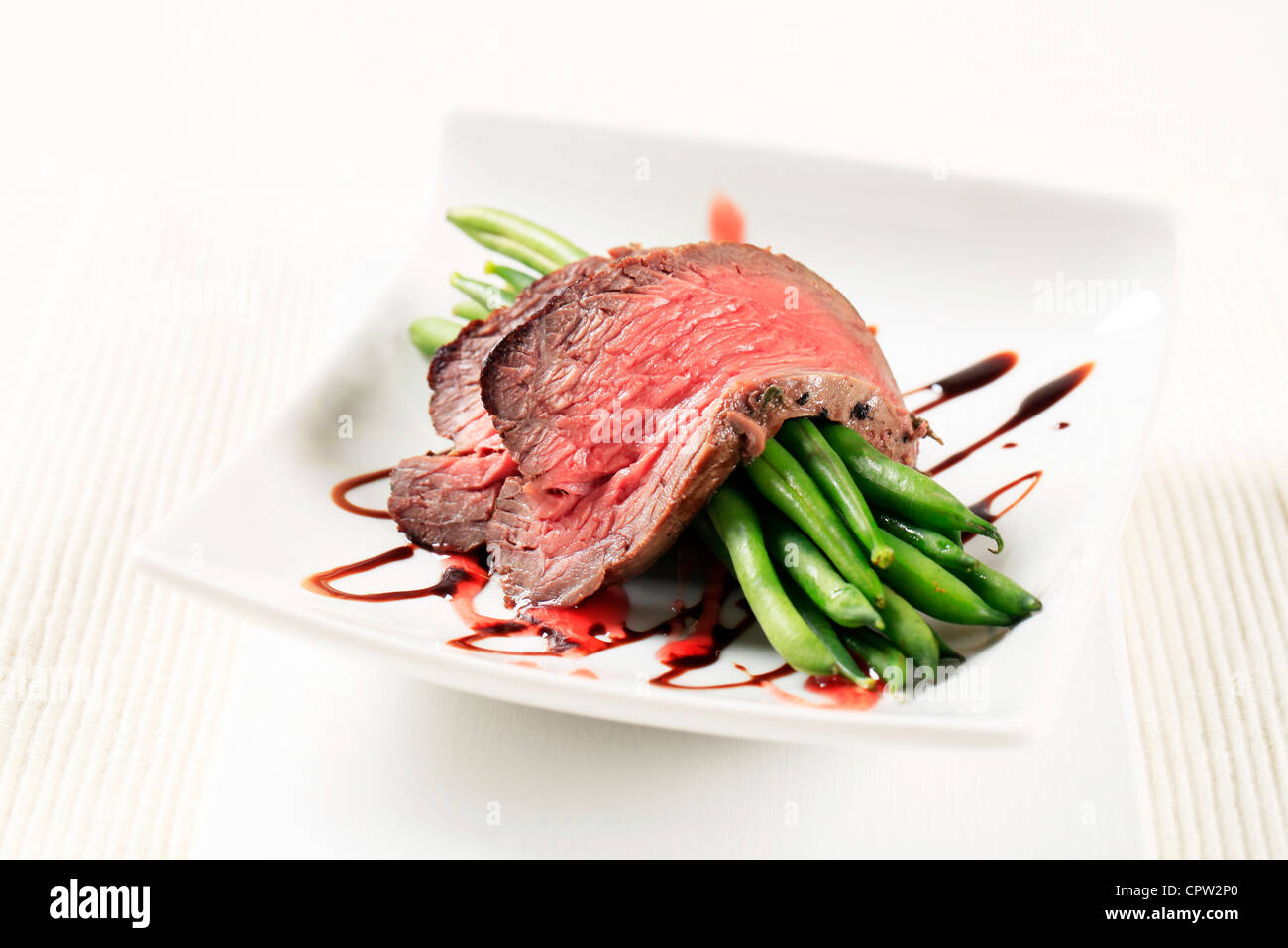 Slices of roast beef and string beans Stock Photo - Alamy