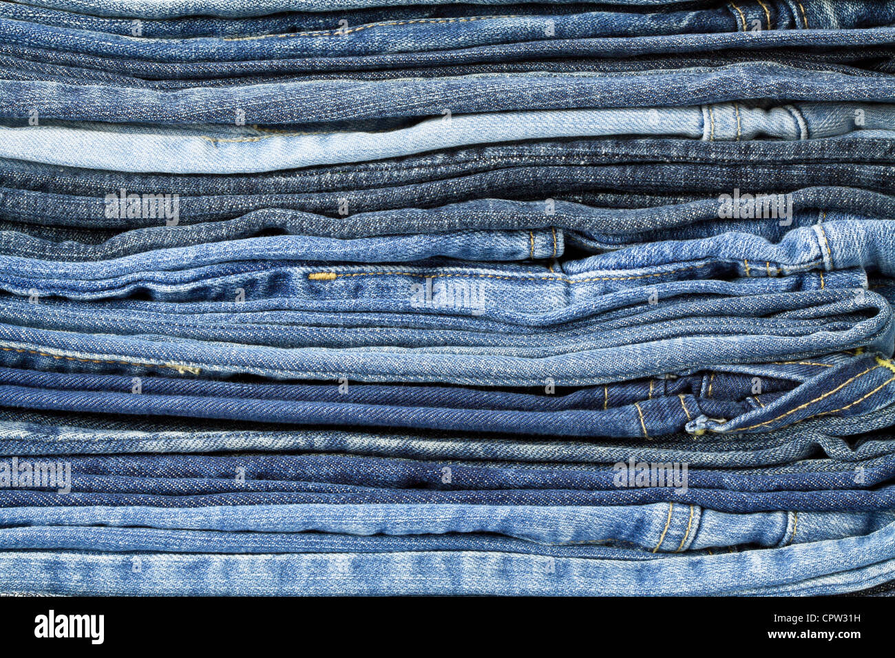 Jeans trousers stack closeup Stock Photo - Alamy