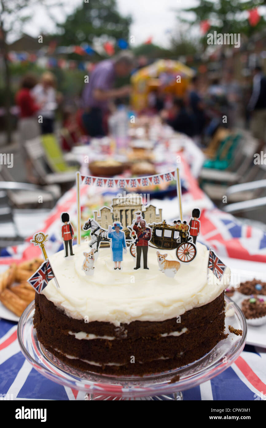 Iced sponge cake with royal family figures at a neighbourhood street ...