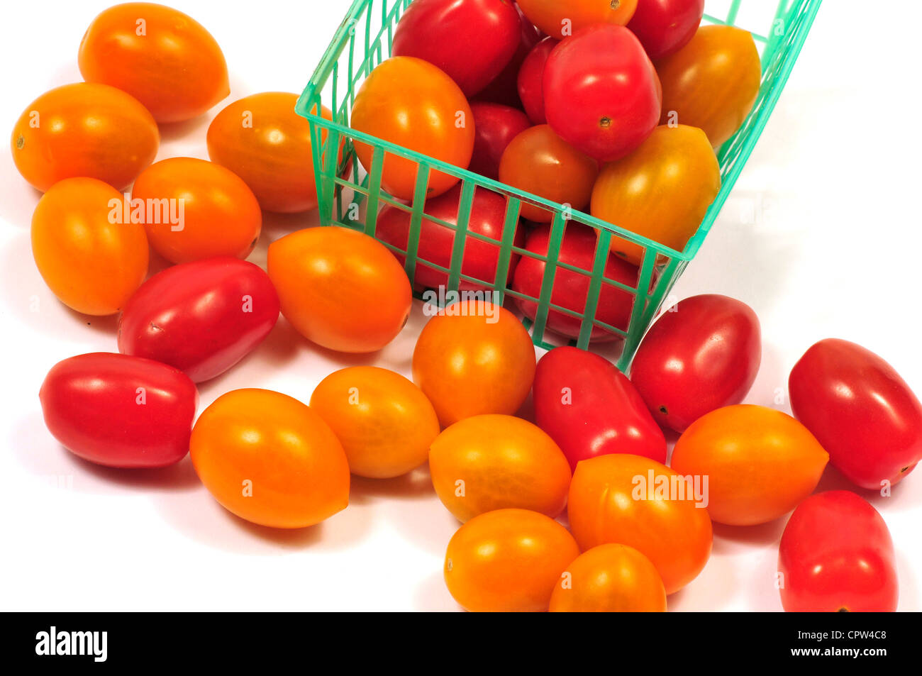 Organic red and yellow Roma tomatoes Stock Photo - Alamy