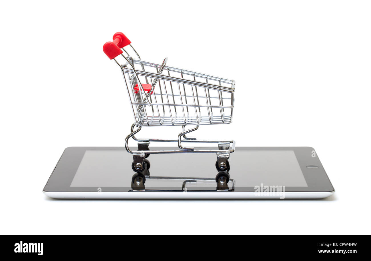 Shopping Cart over a Tablet PC on white background Stock Photo - Alamy