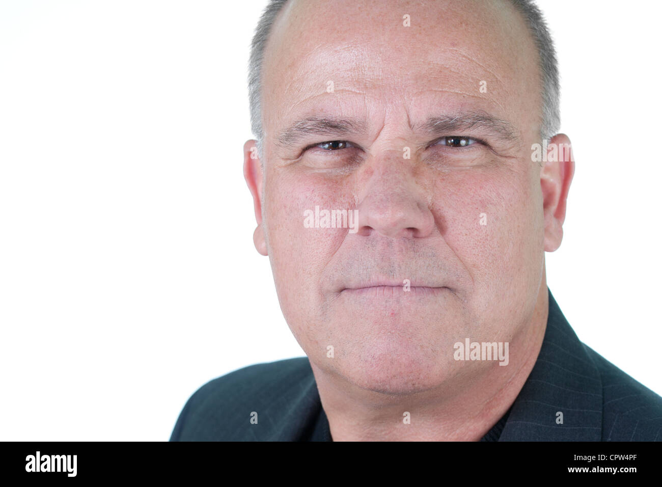 Head shot of man with suspicious expression on face Stock Photo - Alamy