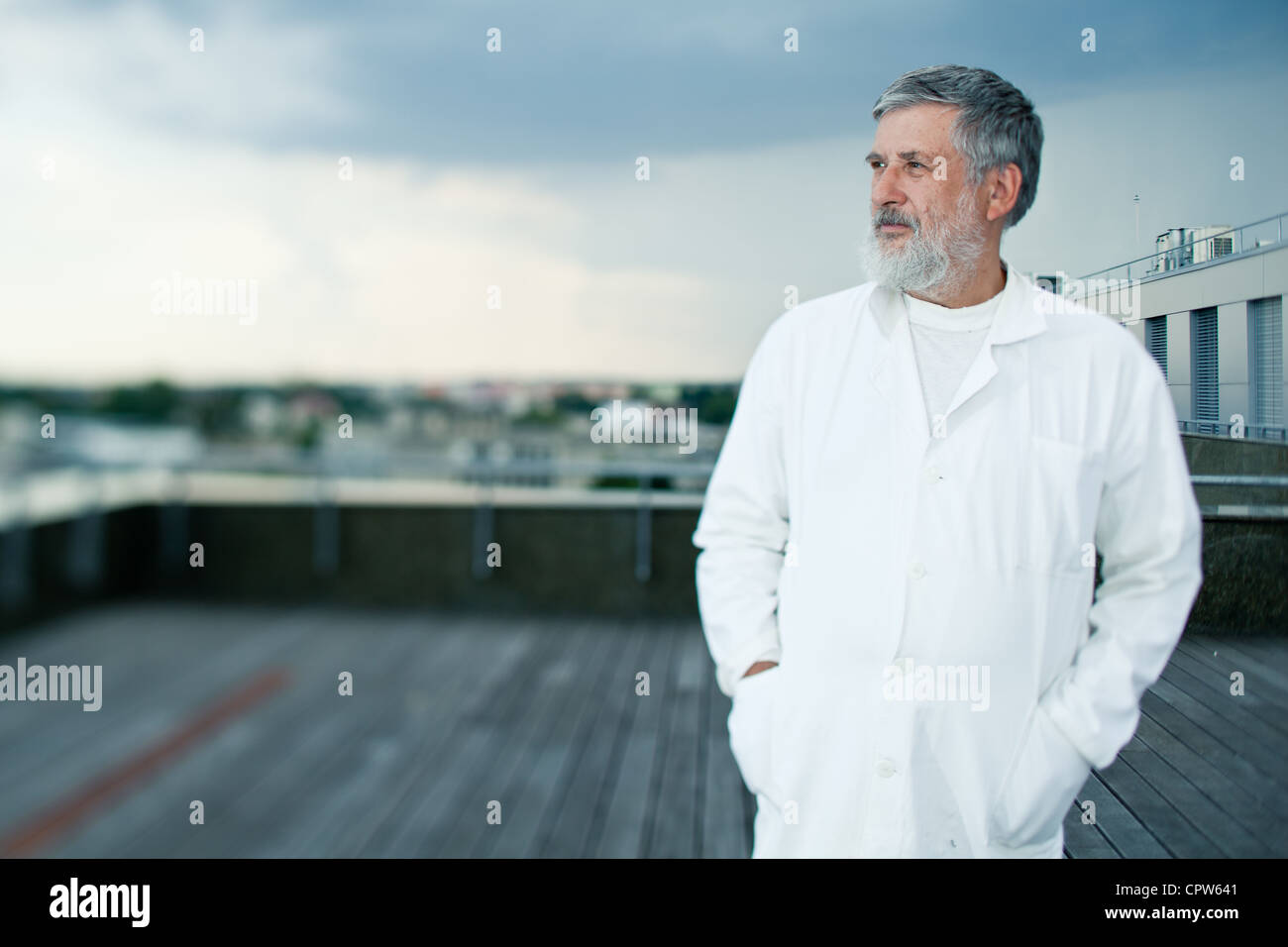 renowned scientist/doctor standing on the roof of the research center ...