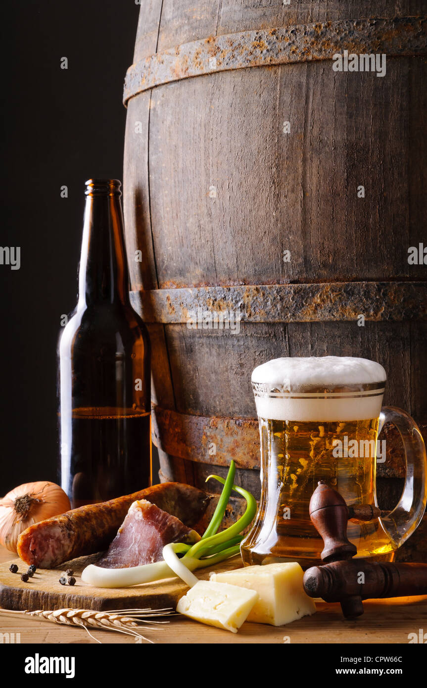 Still life composition with beer mug, wooden barrel and traditional ...