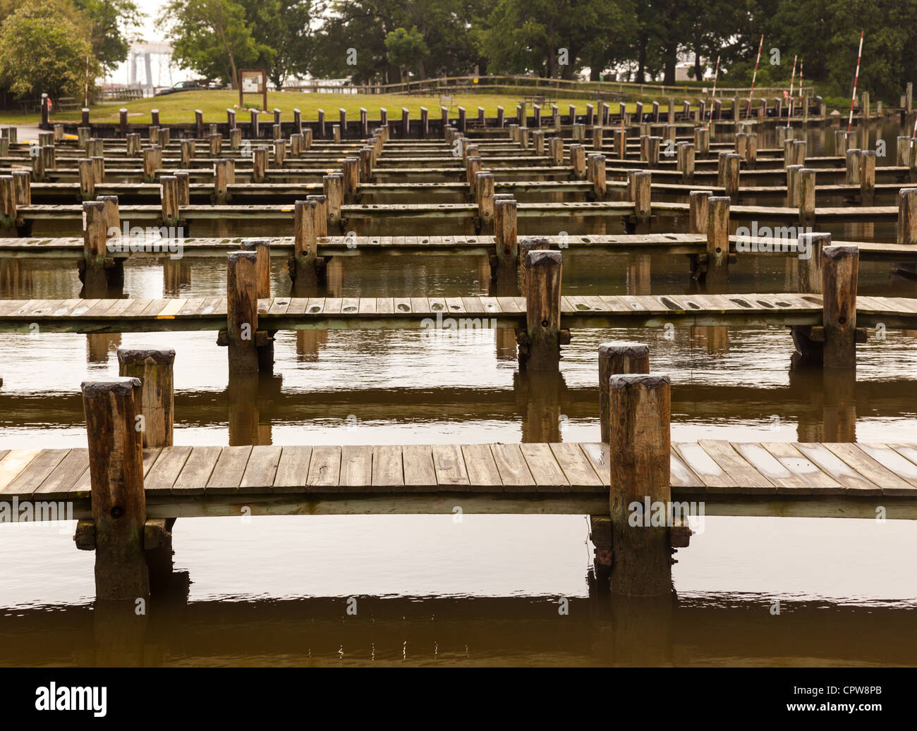 Rows or empty boat docks on a cloudy rainy day with no boats Stock ...