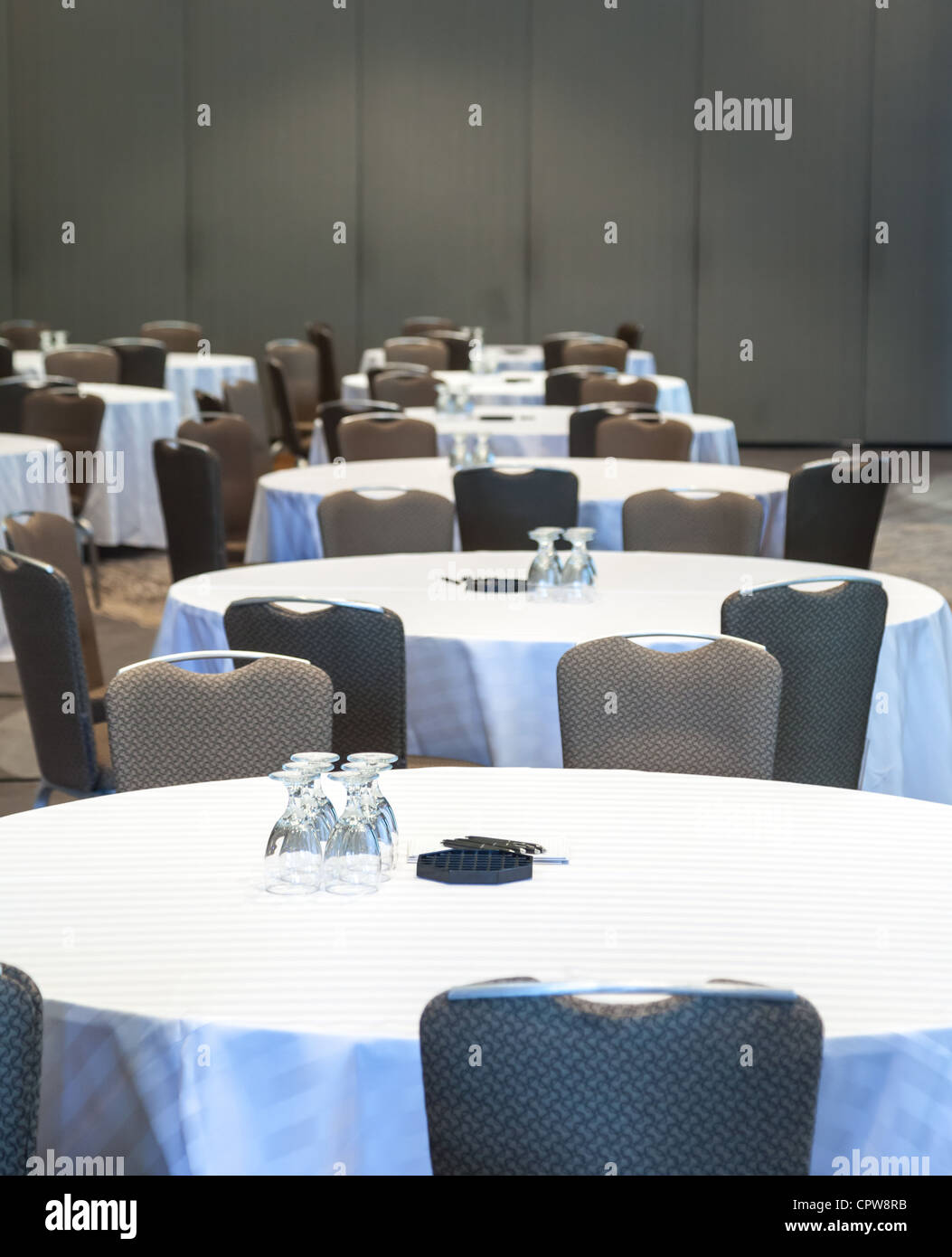 Empty conference room with many tables with white cloths Stock Photo ...