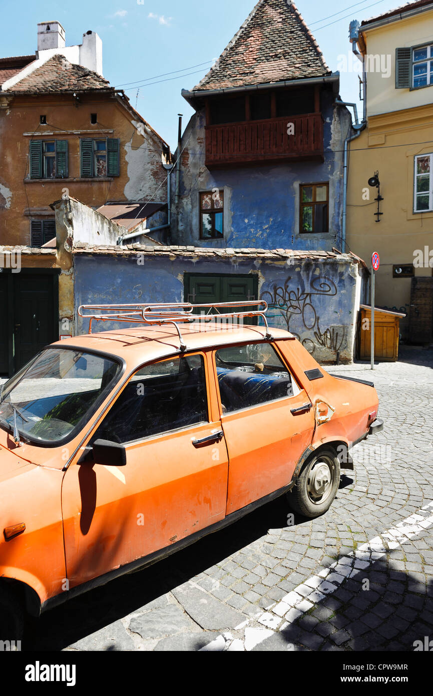 Old orange car Sibiu, Transylvania, Romania Stock Photo - Alamy