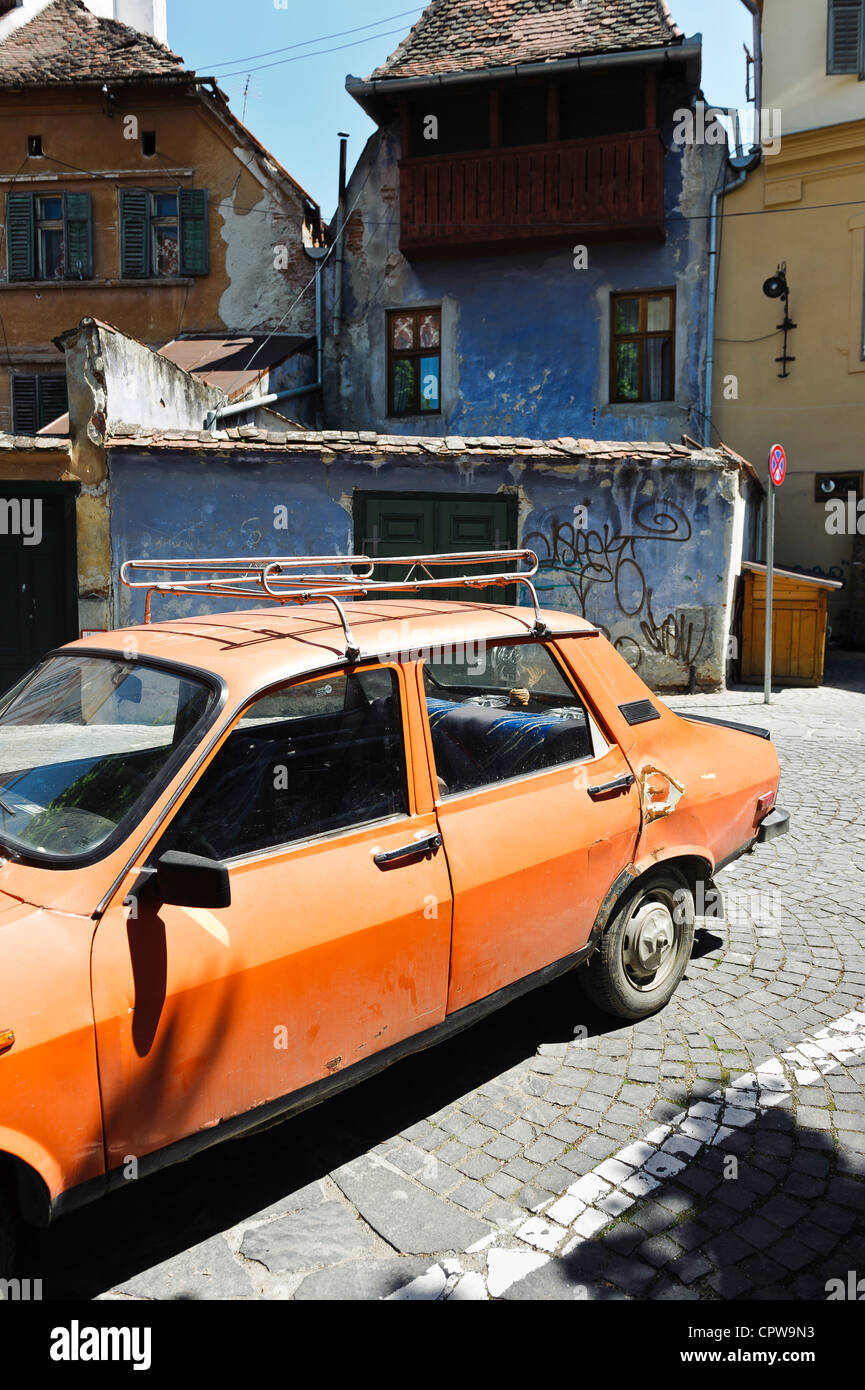 Old orange car Sibiu, Transylvania, Romania Stock Photo - Alamy