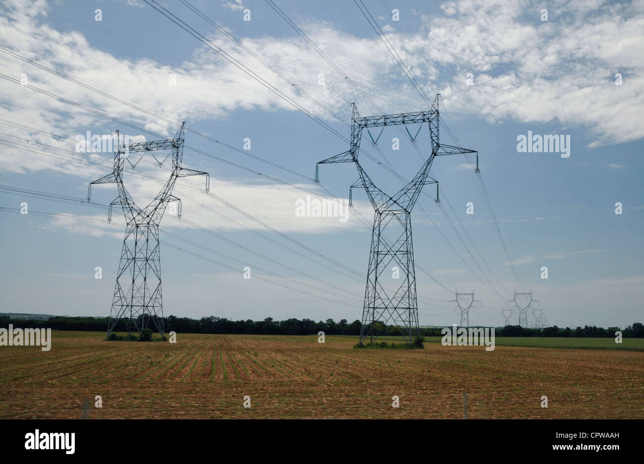 Big Electric Pylons in the Countryside with a blue sky Stock Photo - Alamy
