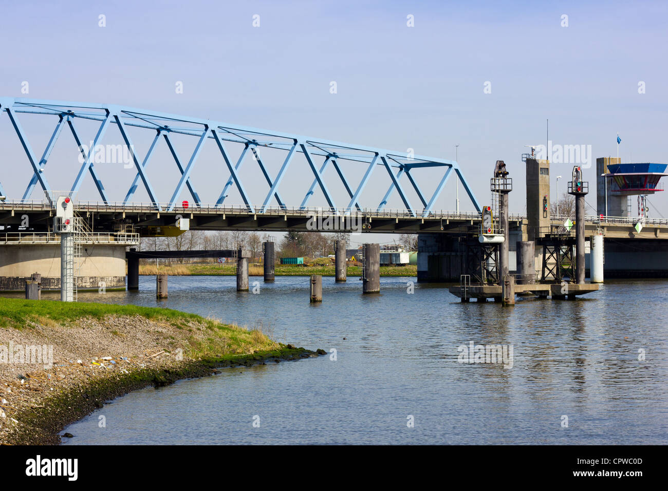 Modern blue bridge over a canal for cargo ships Stock Photo - Alamy