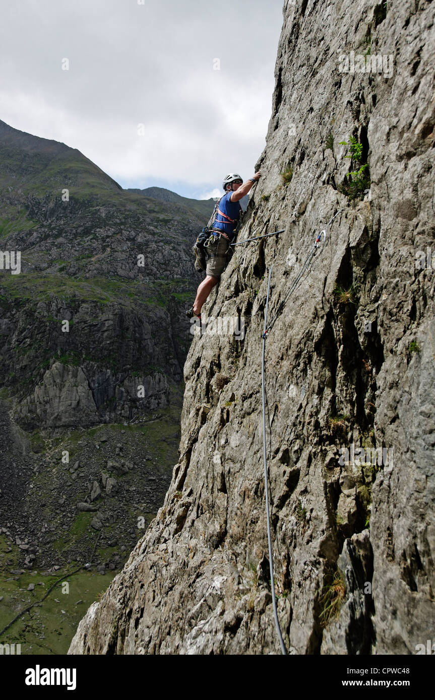A climber leading Spiral Stairs on Dinas Cromlech Stock Photo - Alamy